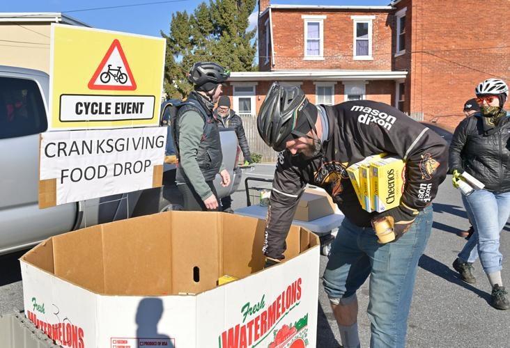 Lancaster bike lovers help gather Thanksgiving food items with ...