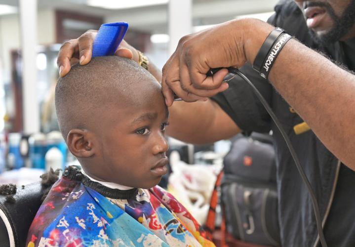 Champ's Barber Shop and School celebrates 20th anniversary with free ...
