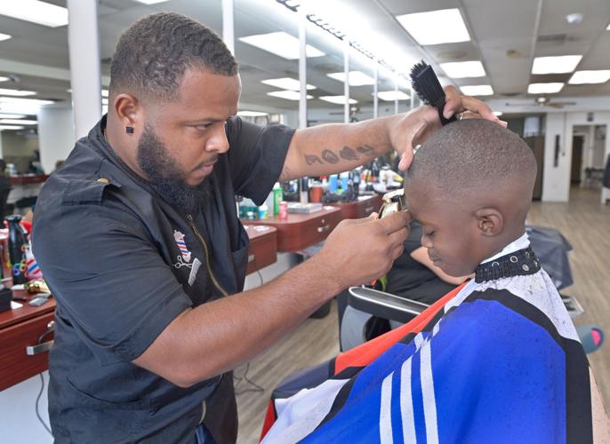 Champ's Barber Shop and School celebrates 20th anniversary with free ...