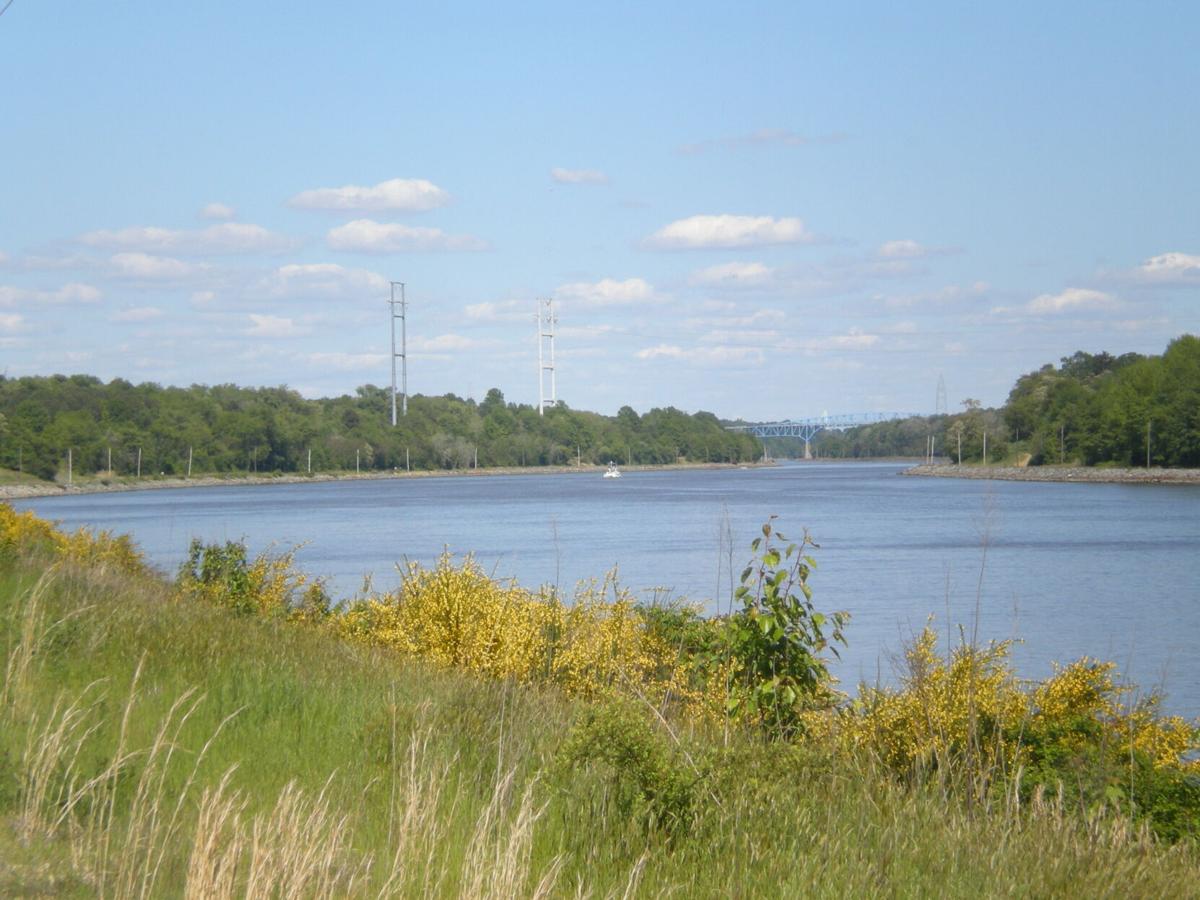 Divided by canal, Chesapeake City, Maryland, a nice place to stroll, dine, bike, sit by the ...