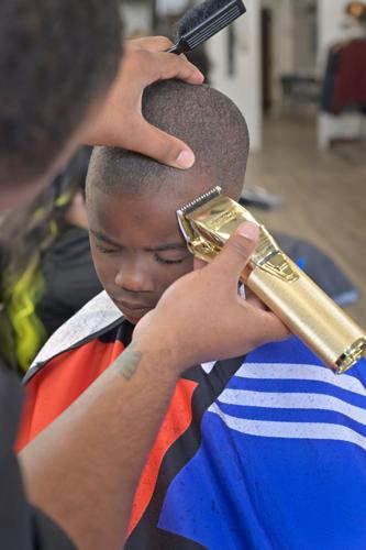 Champ's Barber Shop and School celebrates 20th anniversary with free ...
