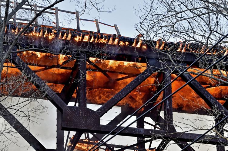 Deck of pedestrian bridge 'a loss' after fire strikes old railroad ...