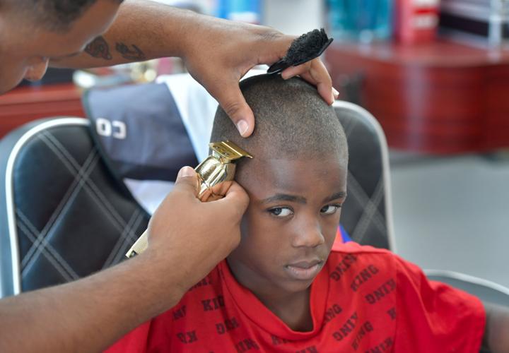 Champ's Barber Shop and School celebrates 20th anniversary with free ...