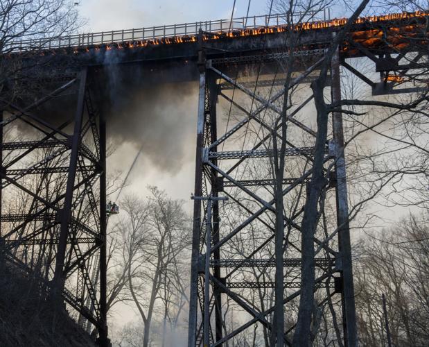 Deck of pedestrian bridge 'a loss' after fire strikes old railroad ...