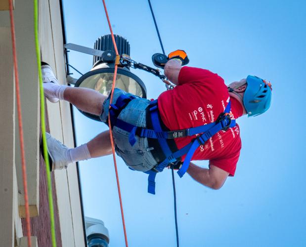 Rappelling down the side of a Lancaster building: VisionCorps Eye Drop ...