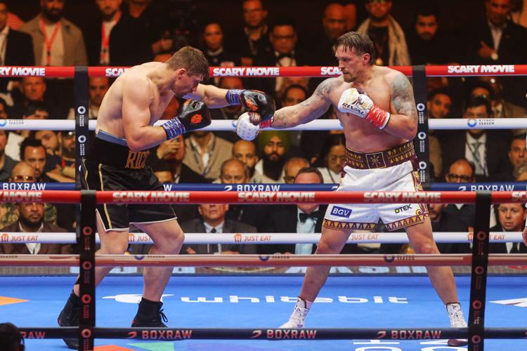 Usyk stops kickboxer Verhoeven in 11th round of heavyweight title fight ...
