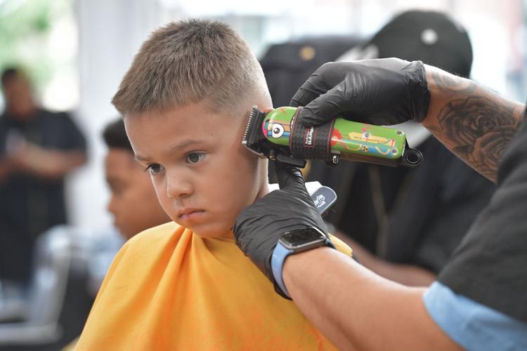 Champ's Barber Shop and School celebrates 20th anniversary with free ...
