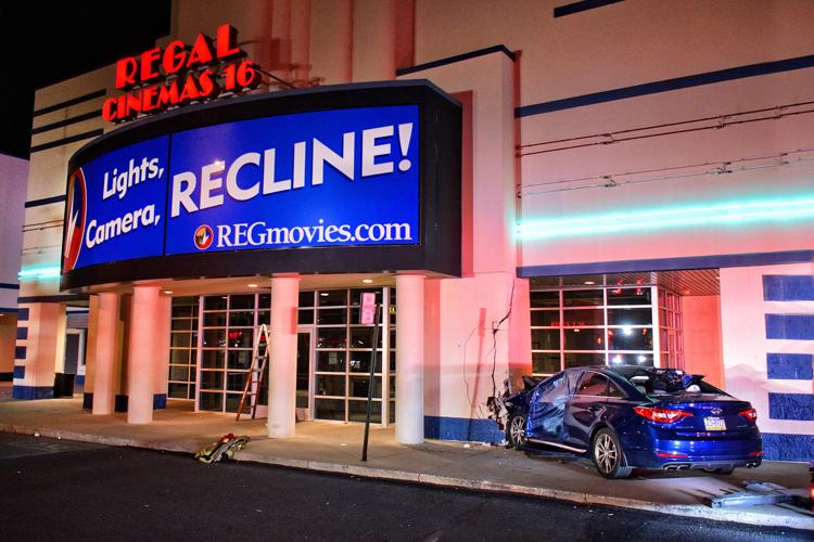 Driver travels length of parking lot, smashes into Regal Cinemas at ...
