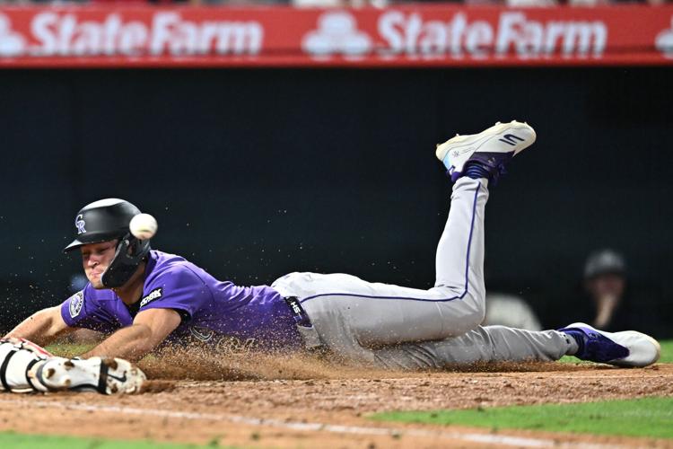 Goodman's 3-run homer and Rumfield's sac fly help Rockies rally for 9-8 ...