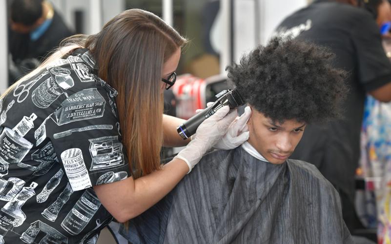 Champ's Barber Shop and School celebrates 20th anniversary with free ...