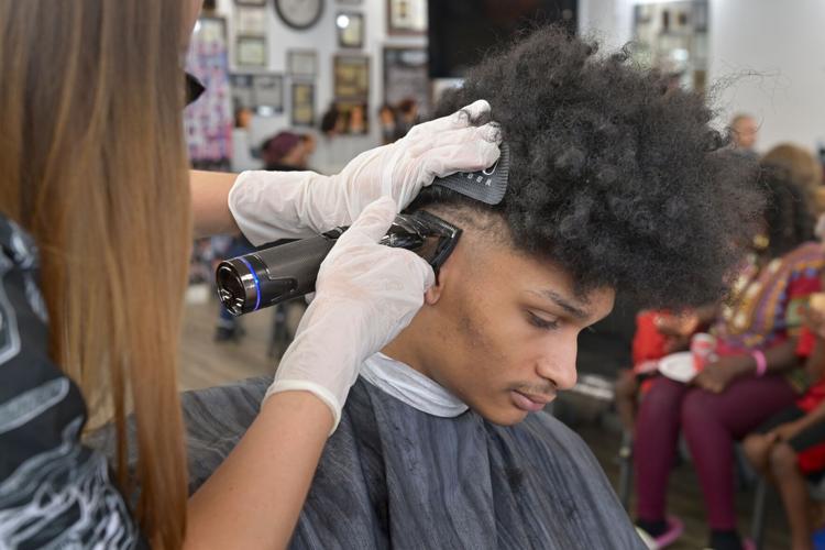 Champ's Barber Shop and School celebrates 20th anniversary with free ...