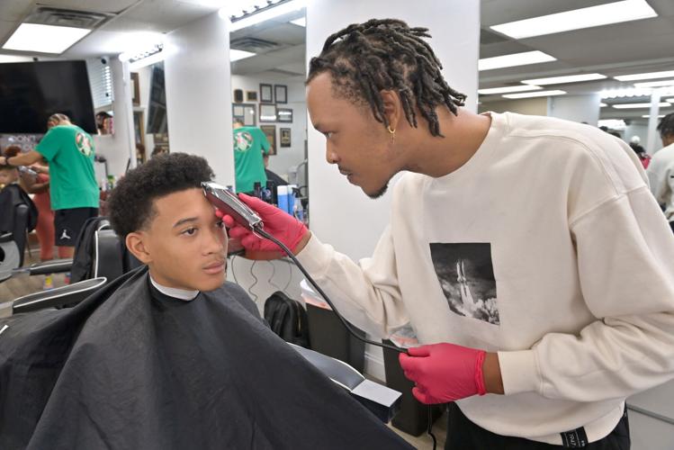 Champ's Barber Shop and School celebrates 20th anniversary with free ...