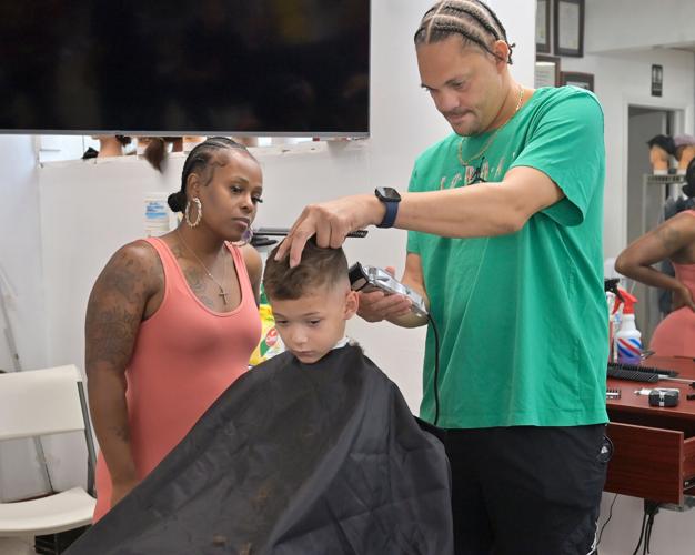 Champ's Barber Shop and School celebrates 20th anniversary with free ...