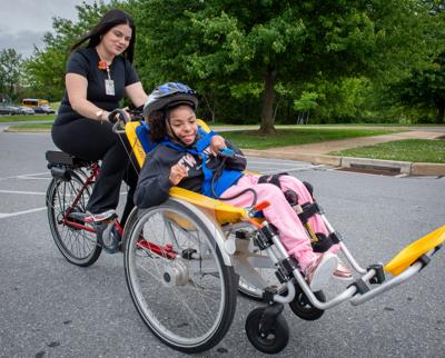 Adapted bicycle, interactive playground empower students at inclusive ...