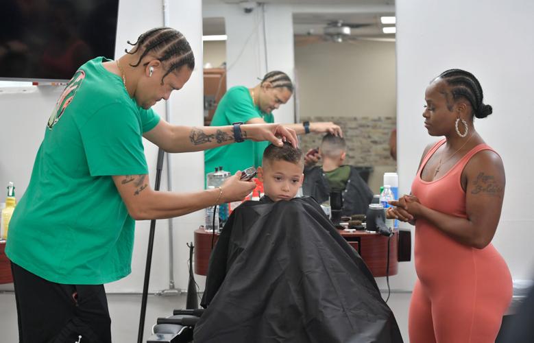 Champ's Barber Shop and School celebrates 20th anniversary with free ...