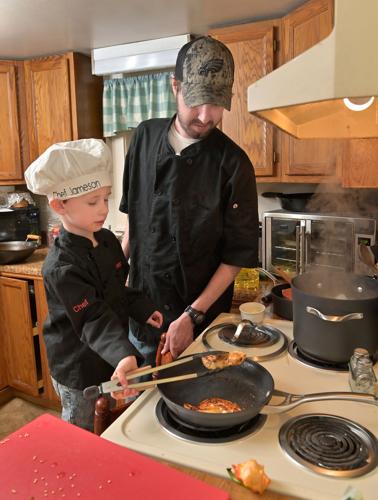Brett and Jameson Geesey enjoy cooking together in their kitchen ...