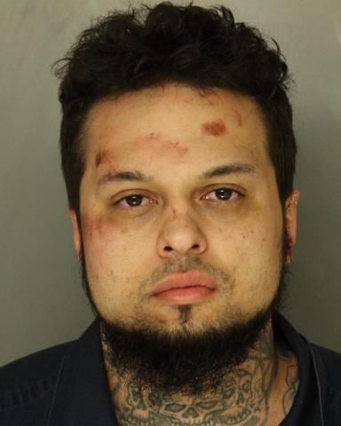 Man charged with punching police officer investigating vehicle break ...