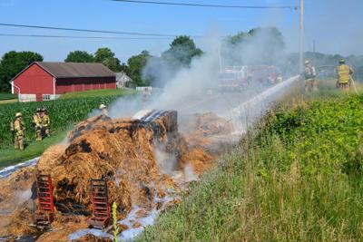 WATCH: Straw fire on tractor-trailer 'looked like a mini-war scene ...