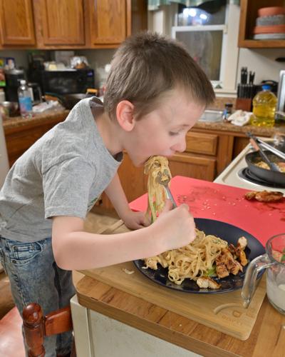 Brett and Jameson Geesey enjoy cooking together in their kitchen ...