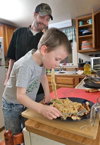 Brett and Jameson Geesey enjoy cooking together in their kitchen ...