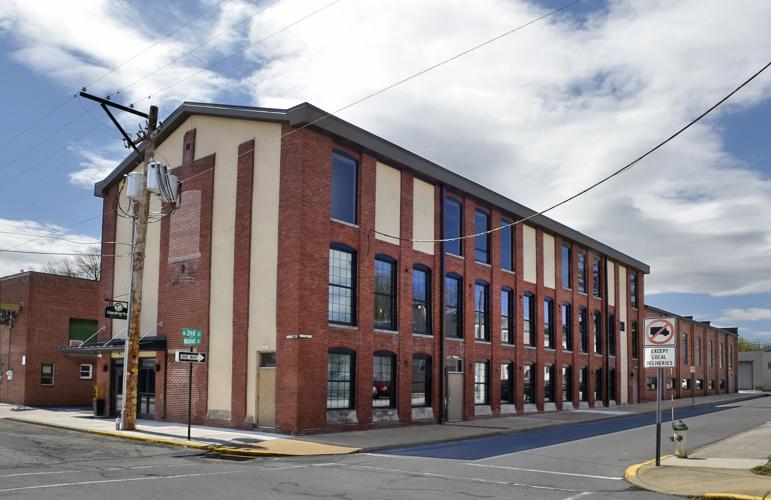 Denver insurance company expands into vacant, historic silk mill ...