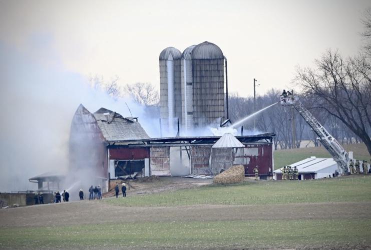 Firefighters save 3 trapped cows while battling barn fire in Colerain ...