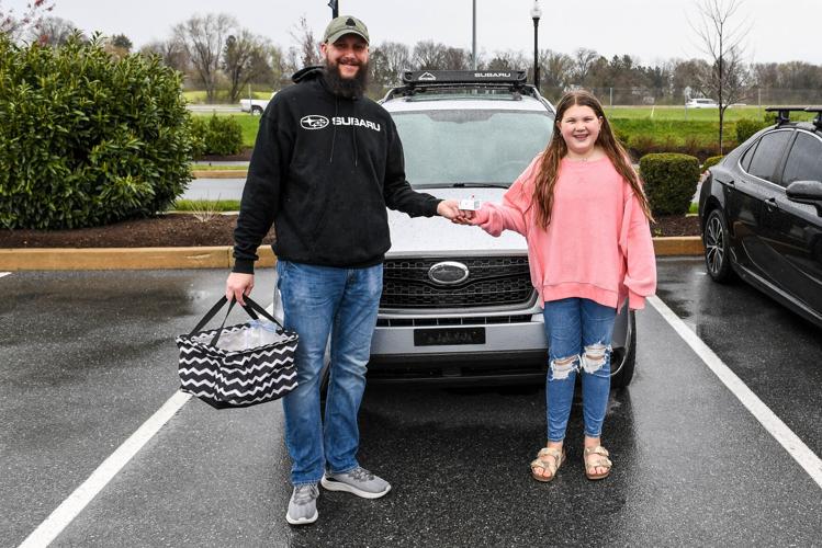 William and Makenzie Pack put cows on cars as part of Moo Moo Subau ...