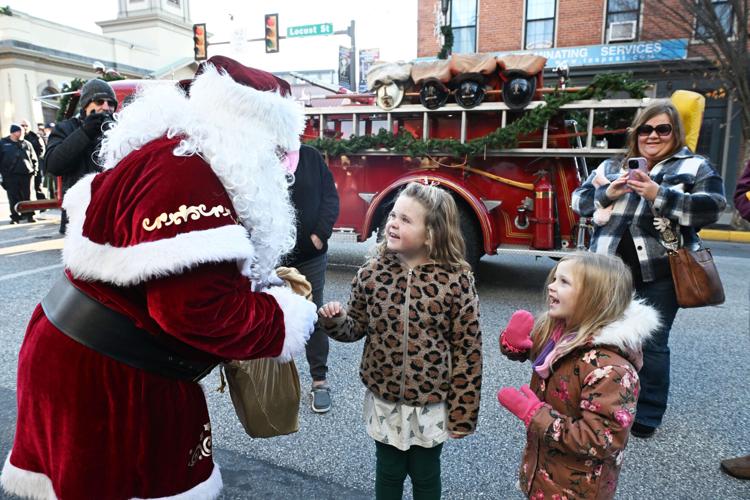 Santa Claus stops by Hinkle's during Columbia's Old-Fashioned Christmas ...