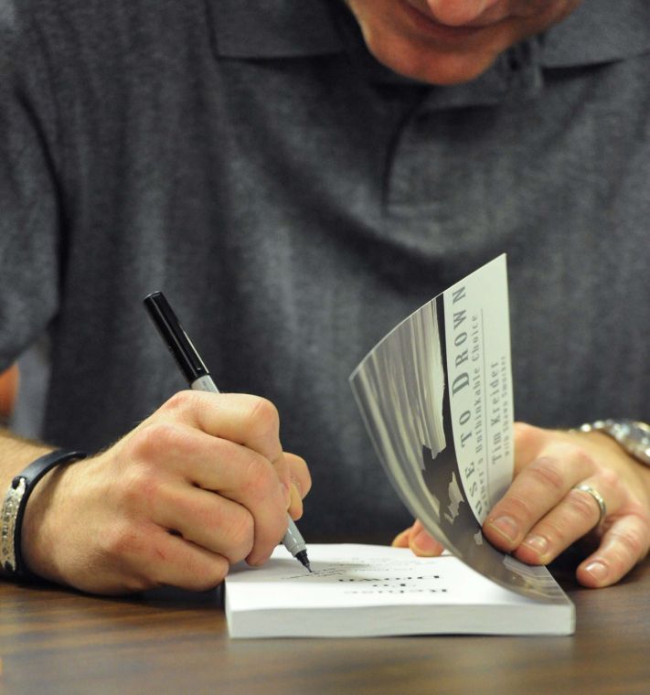 Tim Kreider greets friends, signs book about coping with son's crime ...