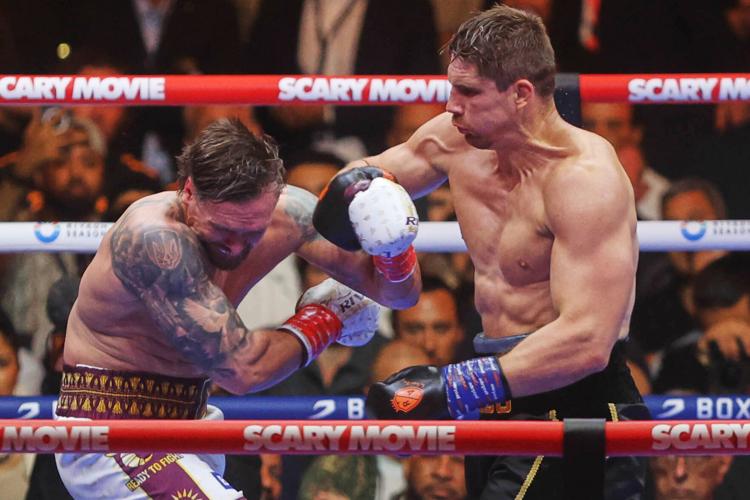 Usyk stops kickboxer Verhoeven in 11th round of heavyweight title fight ...