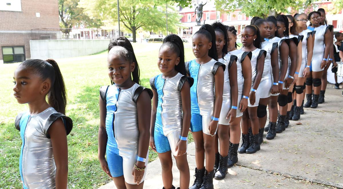Drill teams step to the front of parade that celebrates African ...