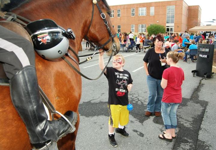 Family Fun Fest at Manor Middle School raises money with bouncing ...