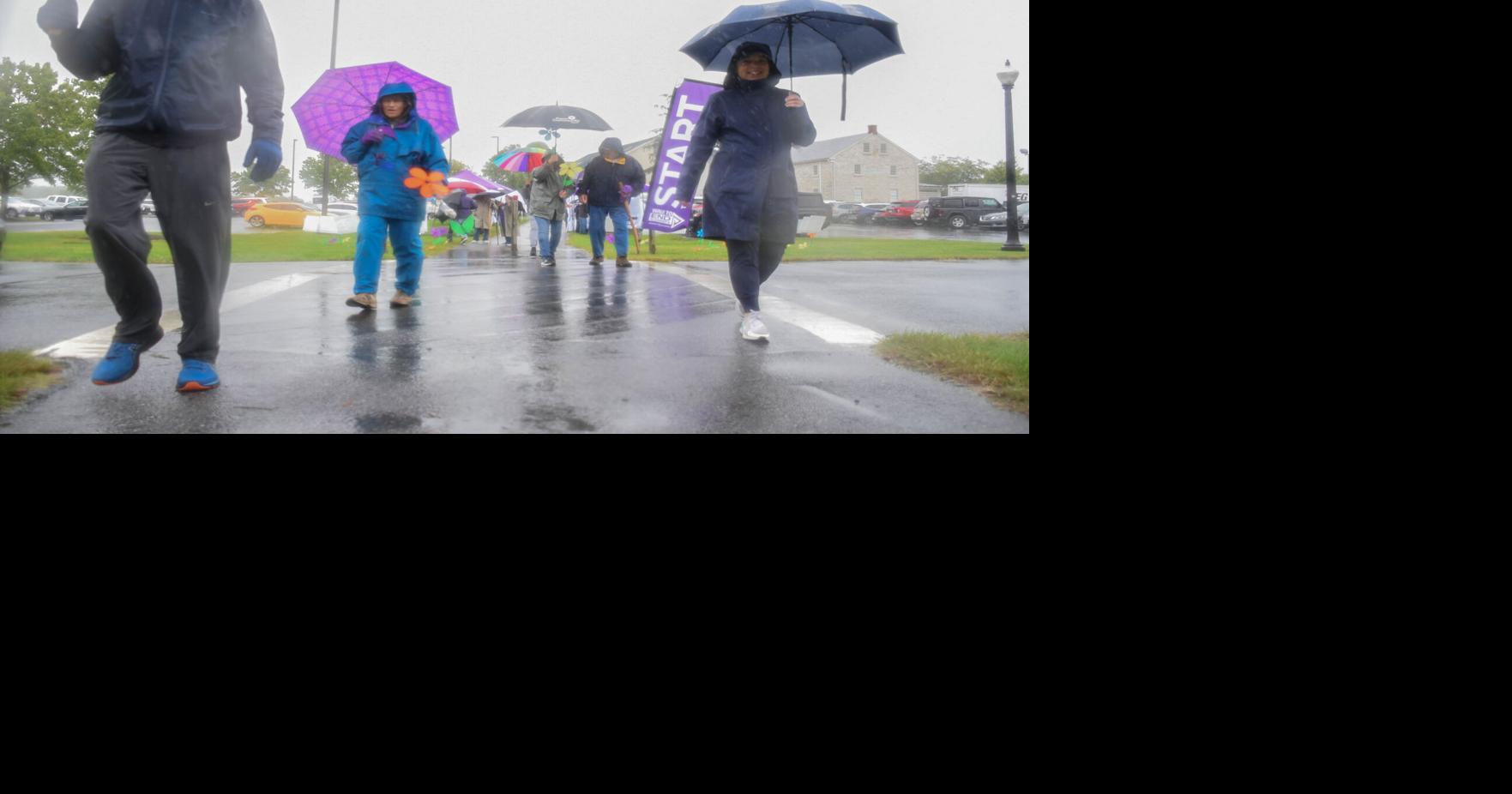 Hundreds with raincoats and umbrellas walk to end Alzheimer's | Local ...