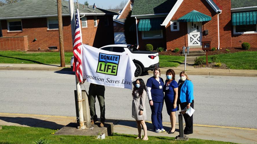 Flag-raising ceremony spotlights importance of organ donation | Local ...