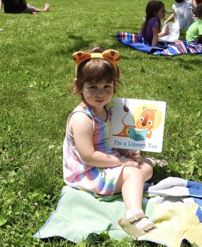 Families gather for story time with Karen Herc during Mister Rogers ...