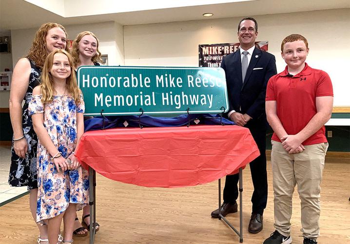 Family, officials celebrate road sign unveiling to honor late Rep. Mike ...
