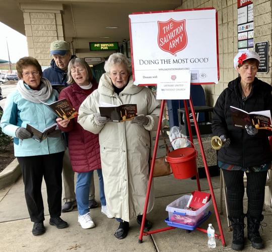 LUMC members carol, ring bell for Salvation Army | Local News ...