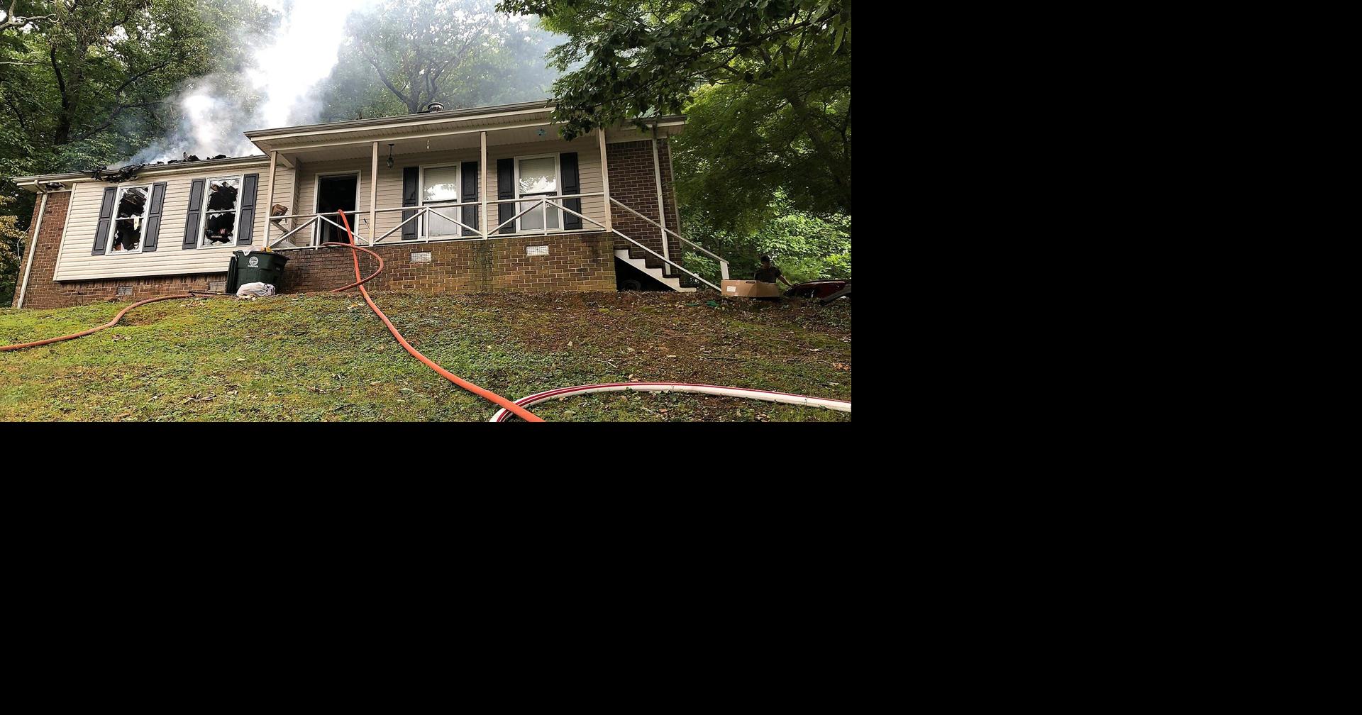 Firefighters battle morning house fire on steep hill in Hixson ...