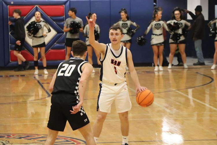 Prep boys basketball: No 1 Tug Valley runs away from Man in second half ...