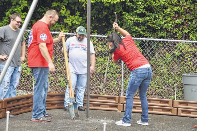 Lowes builds handicapped swing at Dingess Elementary | News ...