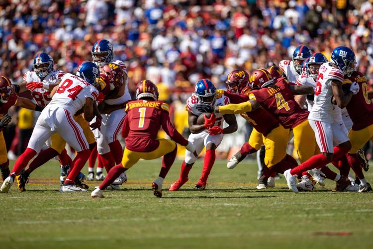 PHOTOS: Commanders outlast Giants for 21-18 win in home opener ...