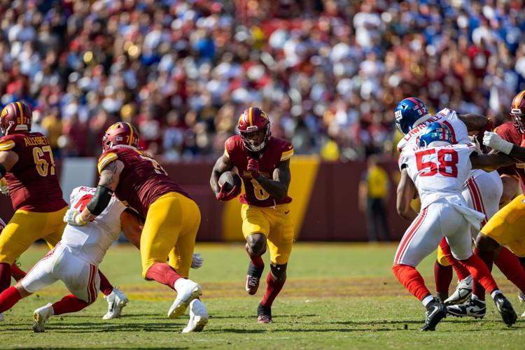 PHOTOS: Commanders outlast Giants for 21-18 win in home opener ...
