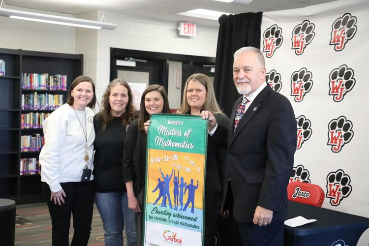 Woods presents Leadership Banners to JCSS schools | School ...