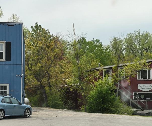 Crane appears on site where proposed cell phone tower would be built ...