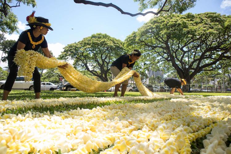 BEHIND THE SCENES: The ladies behind the long strands of leis for the ...