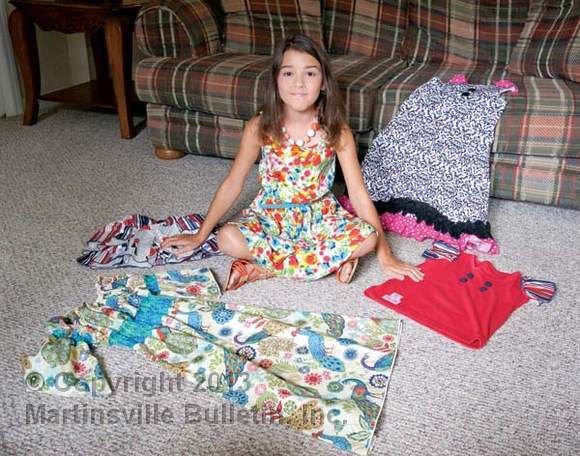 Girl wears her own clothing designs