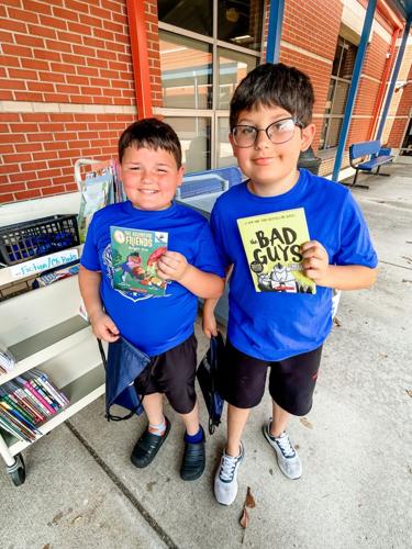 Graves County kids choose free books at meal pickup site | News ...