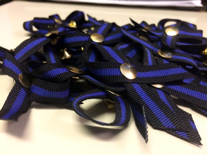 'Epitome of a hero': Ribbons and donations for fallen Shelby officer