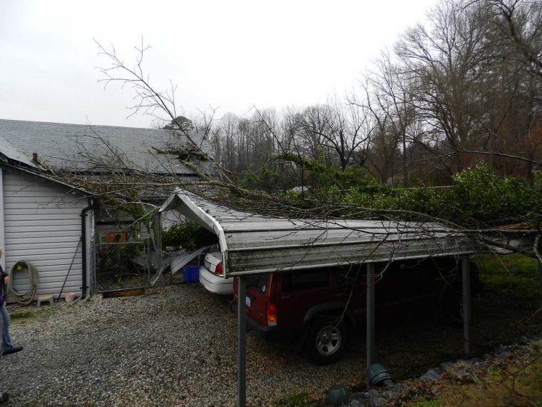 Tree pummels family’s home and carport