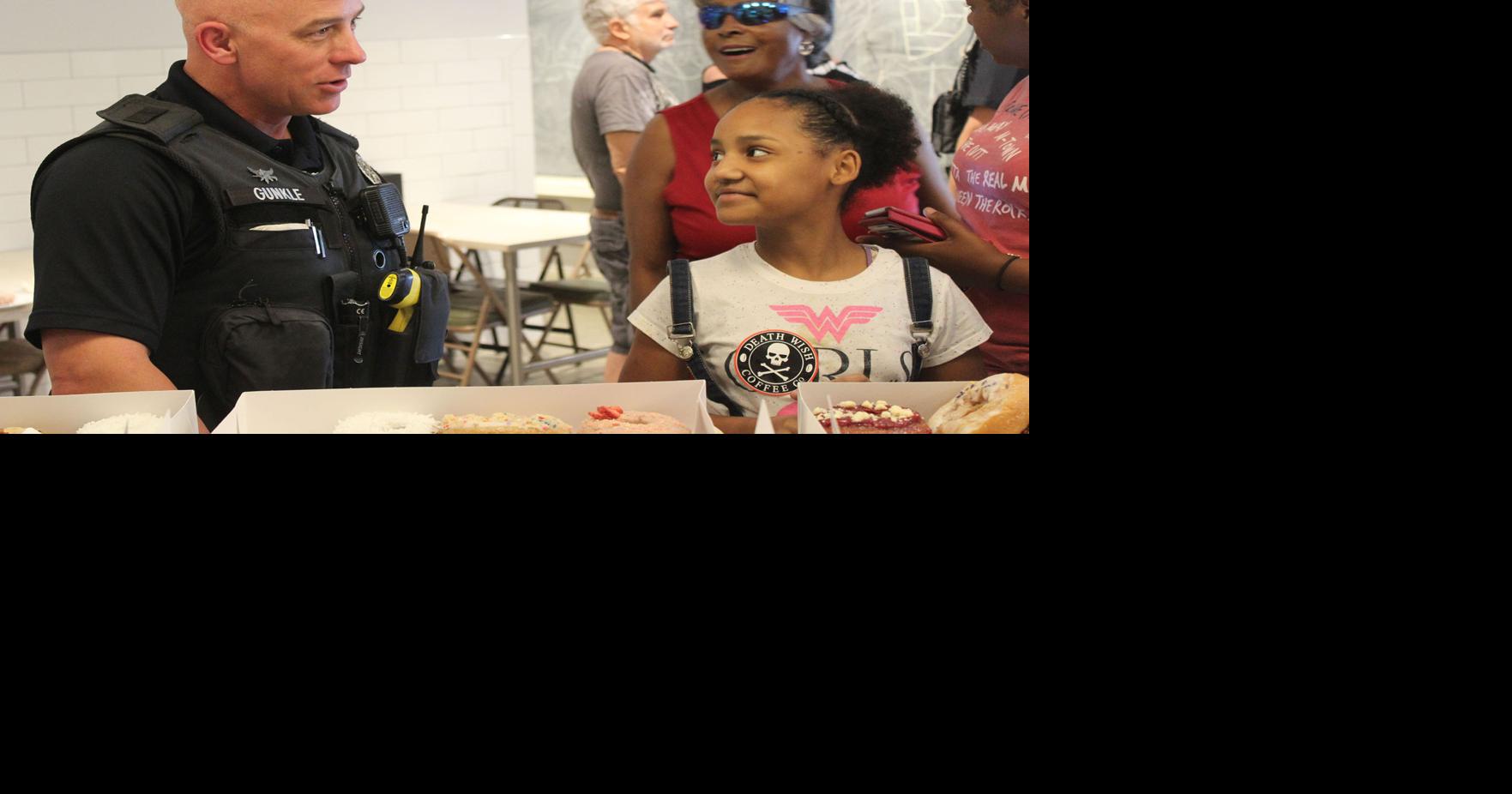 Marietta police officers chat with residents over coffee, doughnuts ...